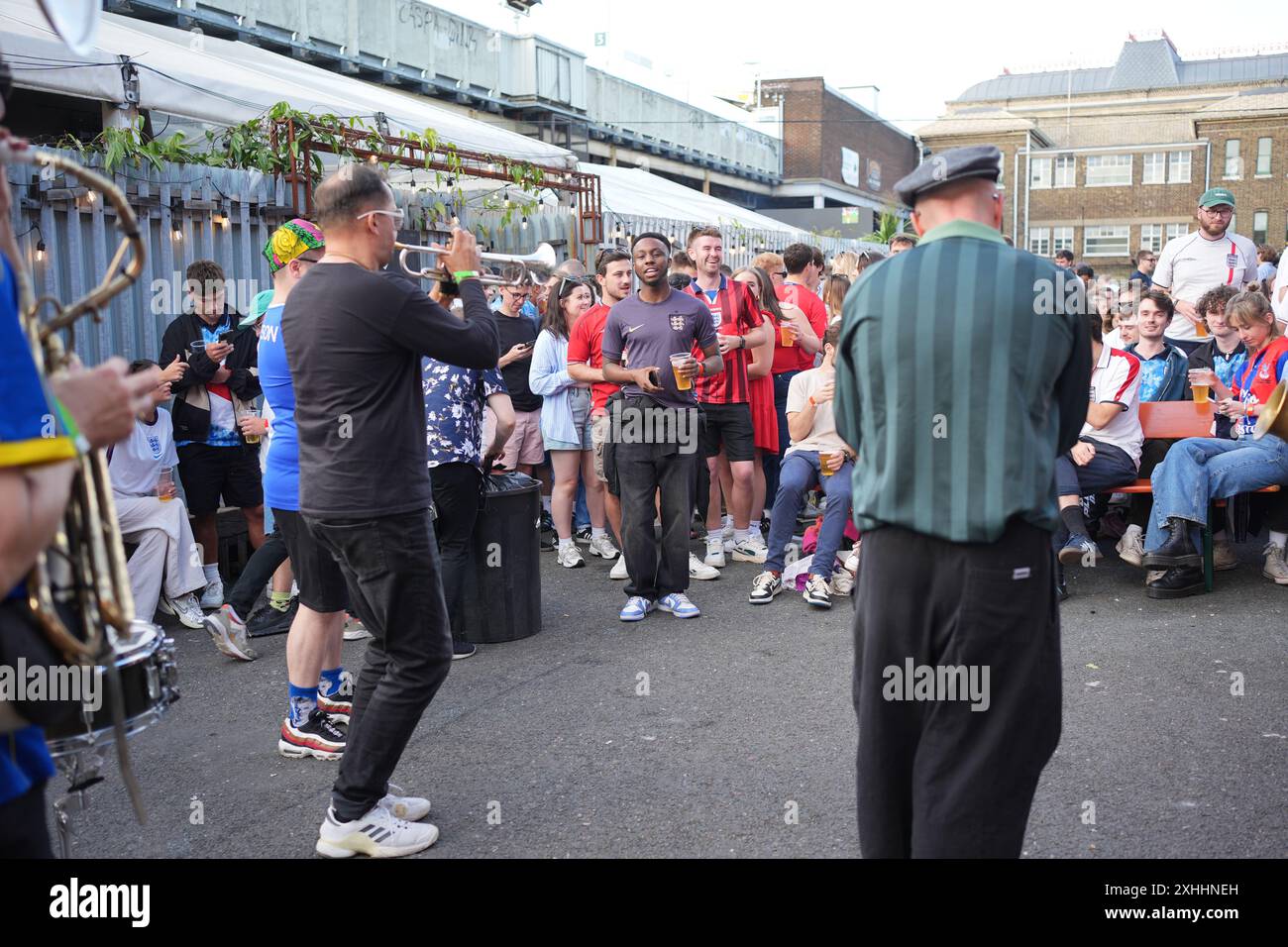 The Saka Horns performing for England fans at Peckham Arches in London ...