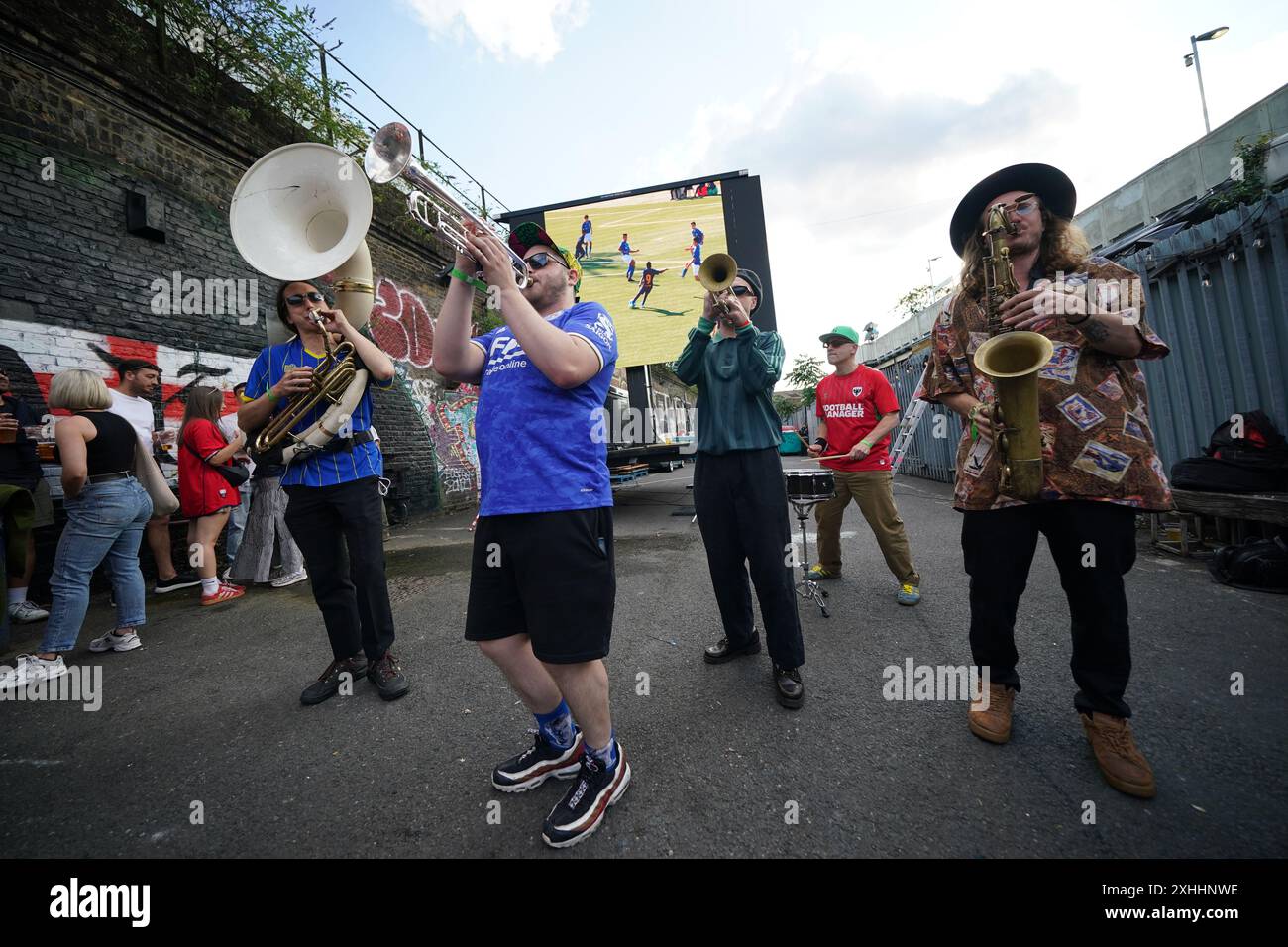 The Saka Horns performing for England fans at Peckham Arches in London ahead of a screening of ...