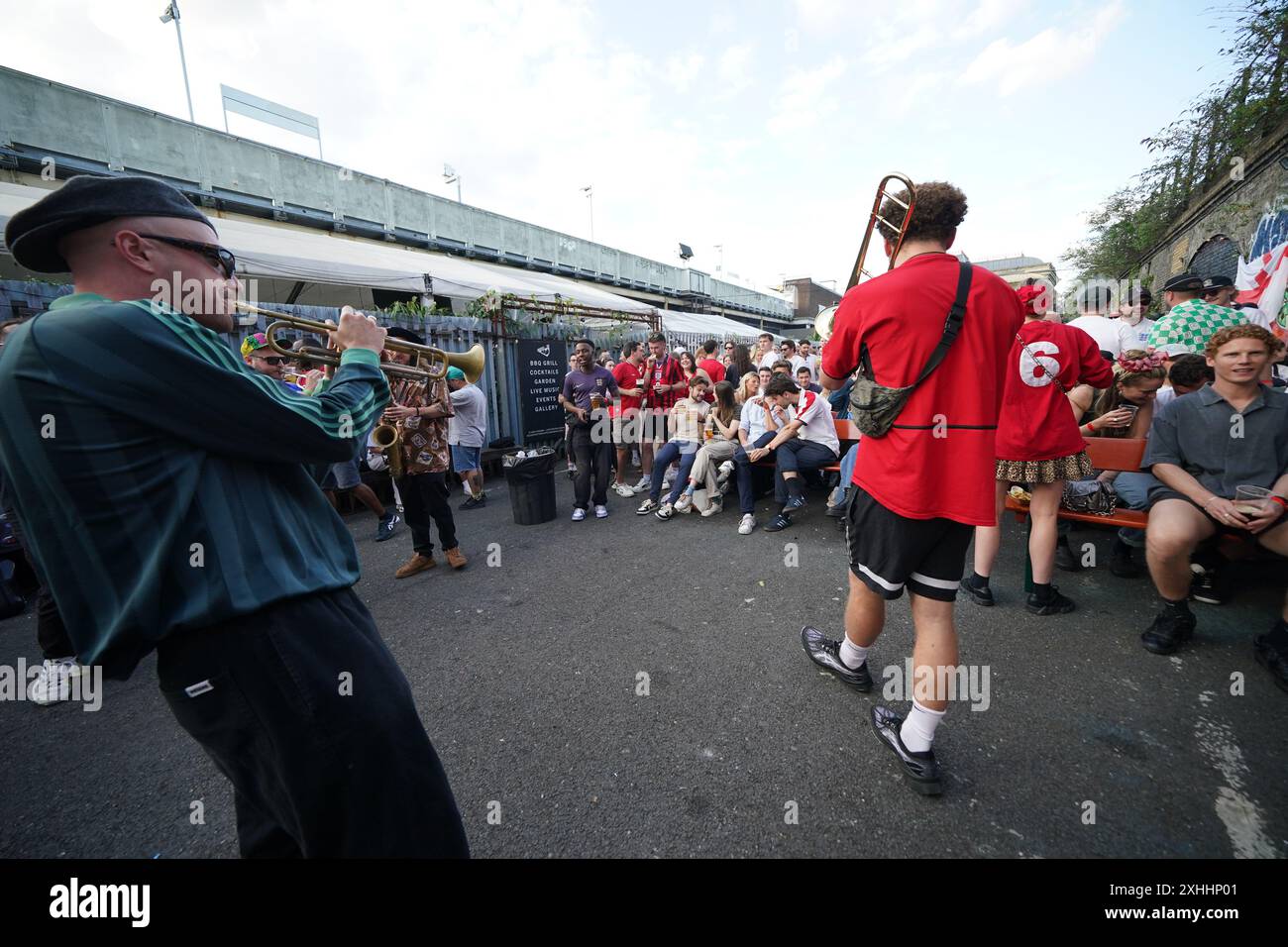The Saka Horns performing for England fans at Peckham Arches in London ...