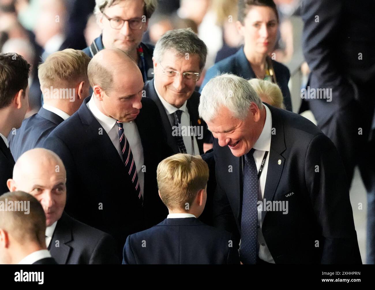 The Prince of Wales and Prince George greet UEFA Executive David Gill ...