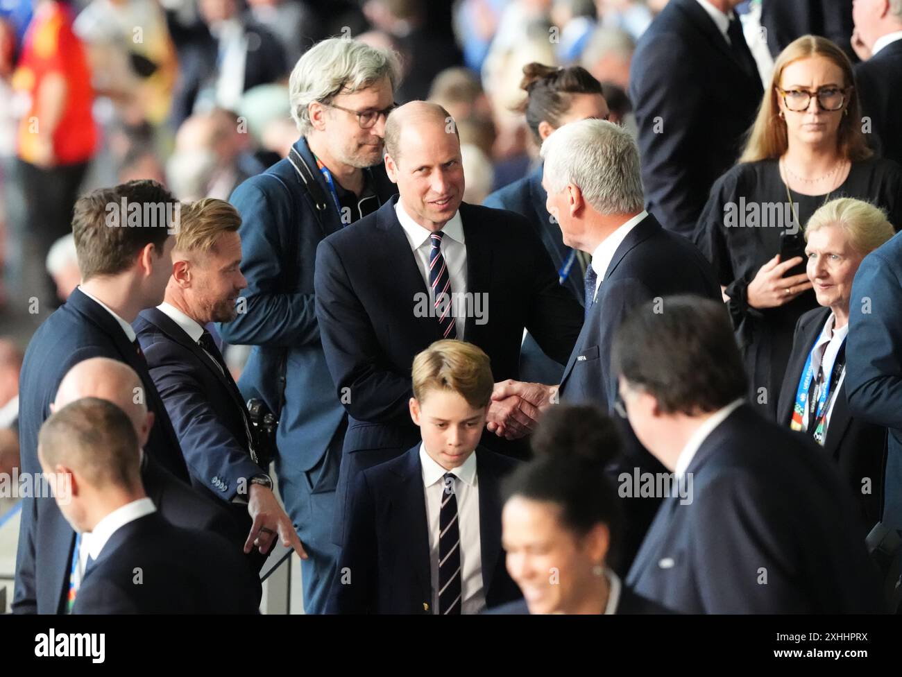 The Prince of Wales and Prince George greet UEFA Executive David Gill ...
