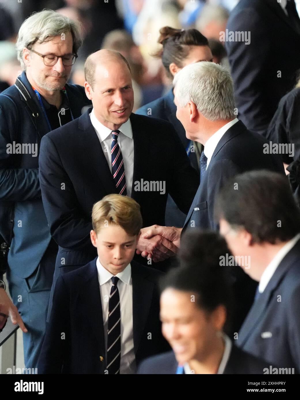 The Prince of Wales and Prince George greet UEFA Executive David Gill ...