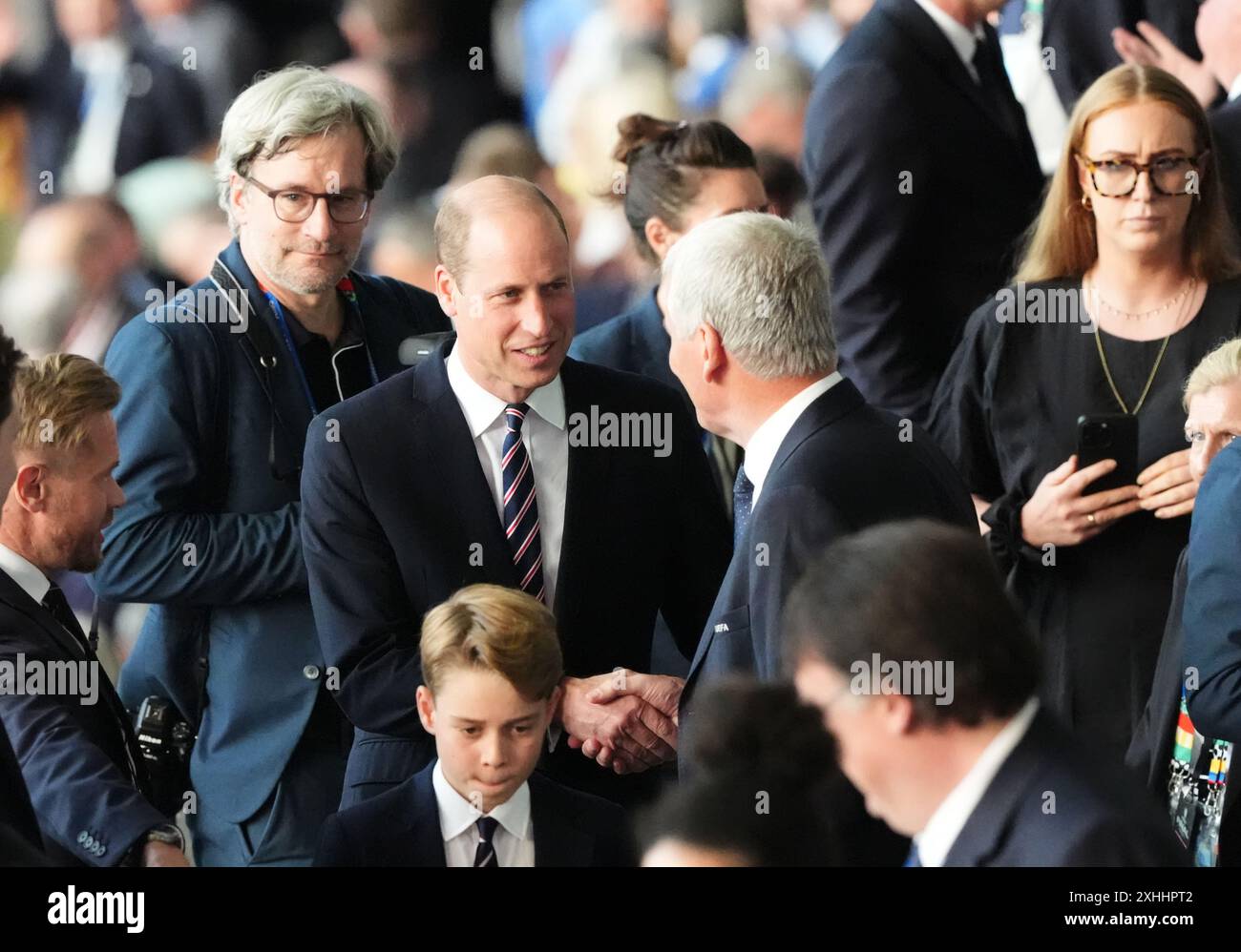 The Prince of Wales and Prince George greet UEFA Executive David Gill ...