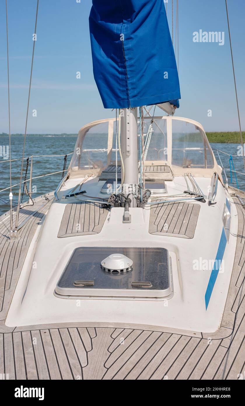 The deck of a sailboat with the sail rolled up, selective focus Stock ...