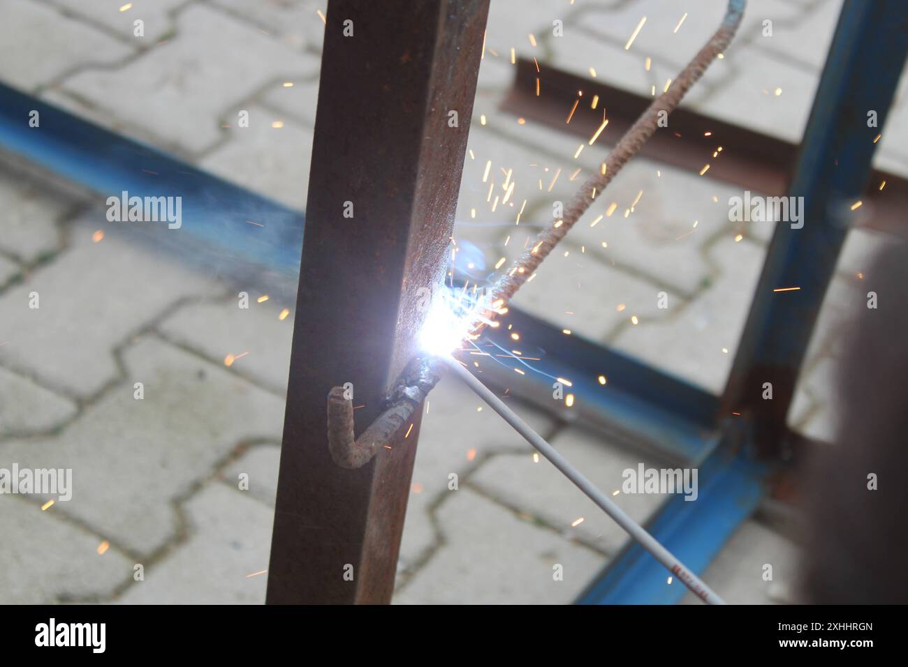 Welding man working on iron welding in construction site. Close up ...