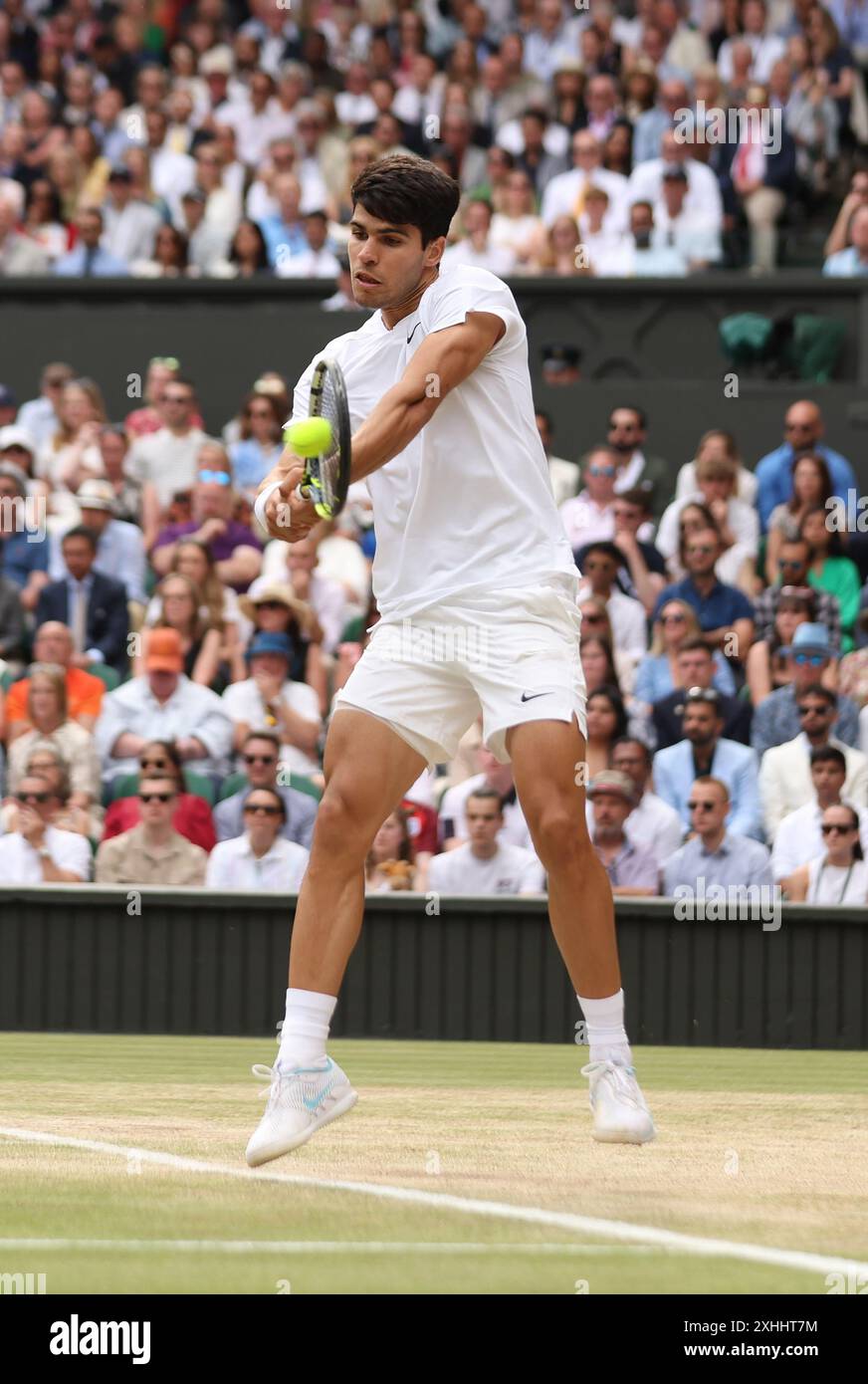 London, UK. 14th July, 2024. Carlos Alcaraz plays a backhand in his Men ...