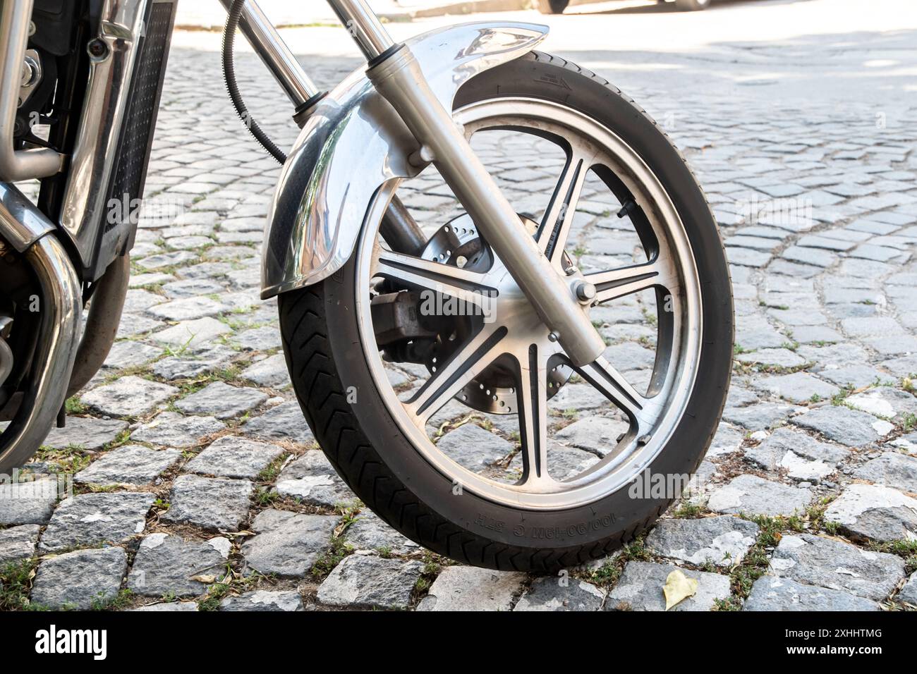 Close up of the front wheel of a classic motorcycle parked on the ...