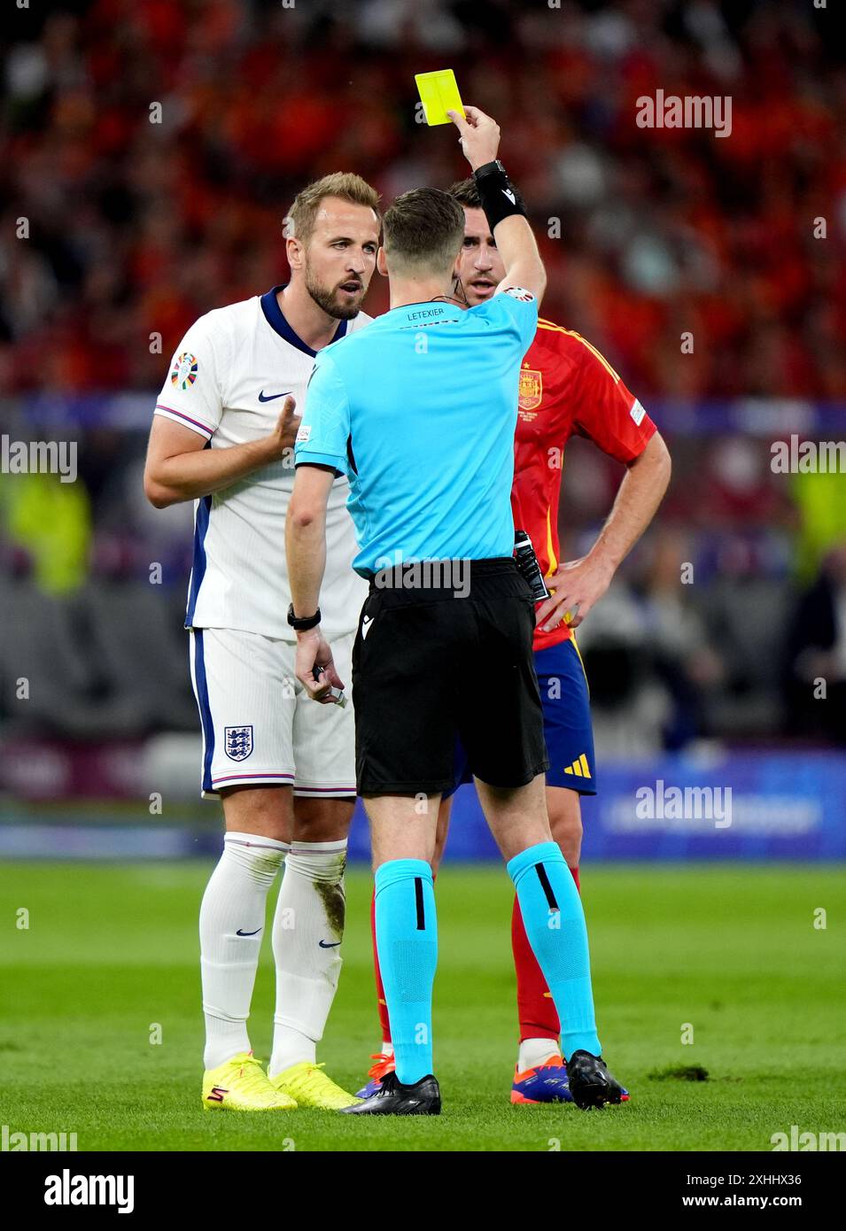 England's Harry Kane is shown a yellow card by referee François ...