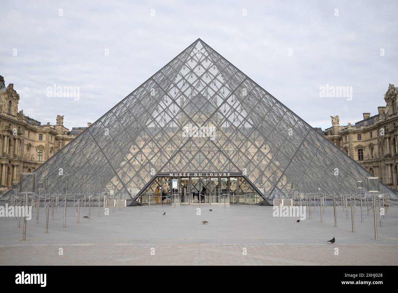 Paris, France. 14th July, 2024. Entrance of the Louvre Pyramid during ...