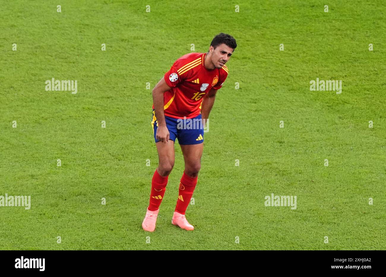 Spain's Rodri holds his leg at half-time during the UEFA Euro 2024 ...