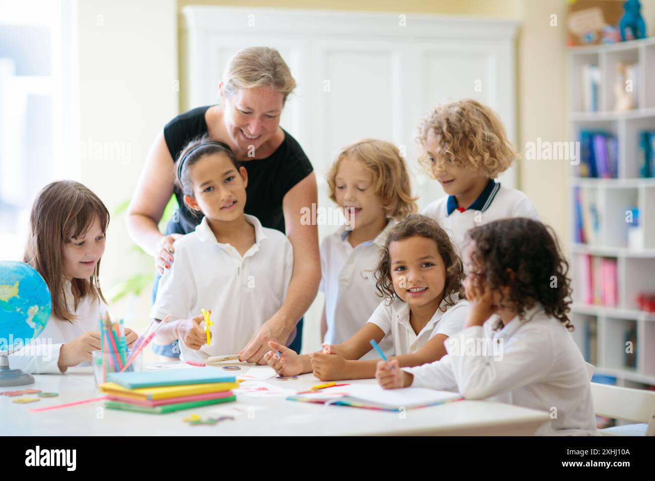 Kids go back to school. Interracial group of children of mixed age in ...