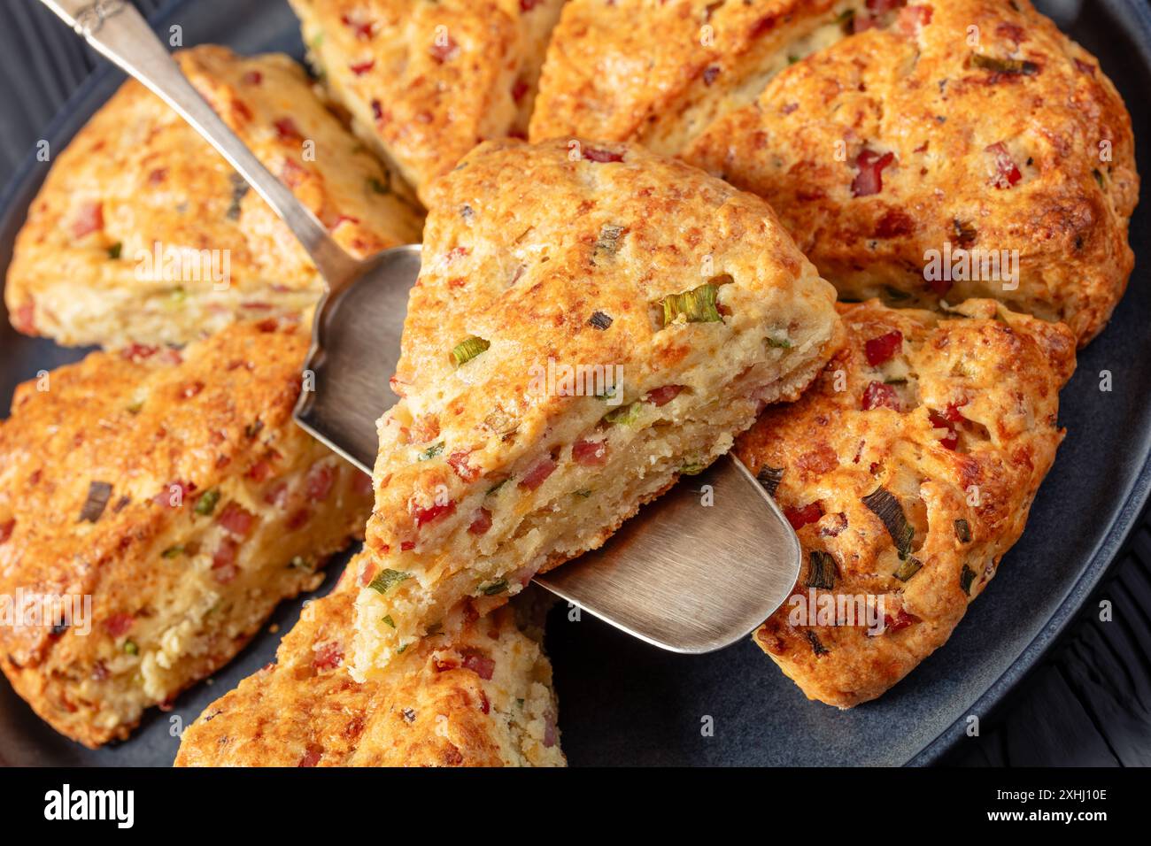 freshly baked Ham and cheese triangle american scones on platter, close ...