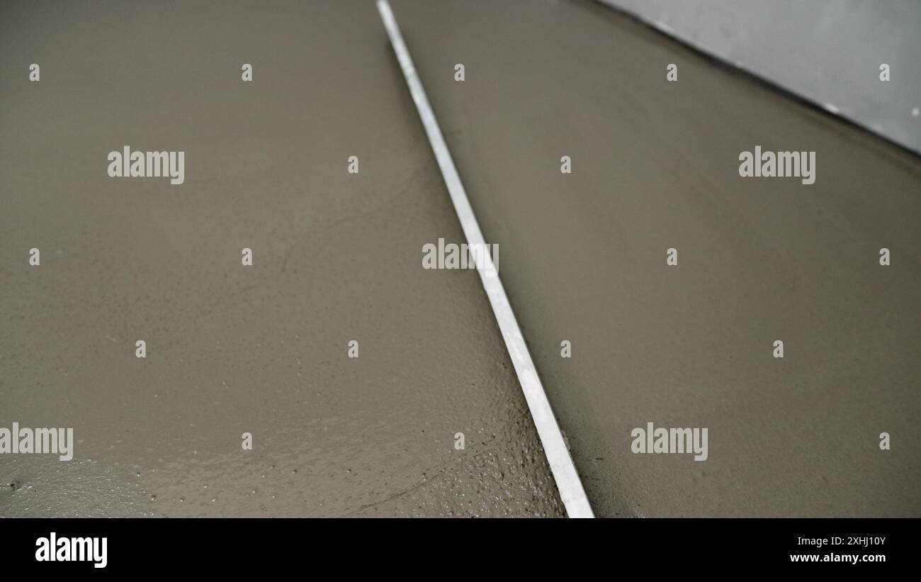 Construction worker mixes wet grey hi-res stock photography and images ...