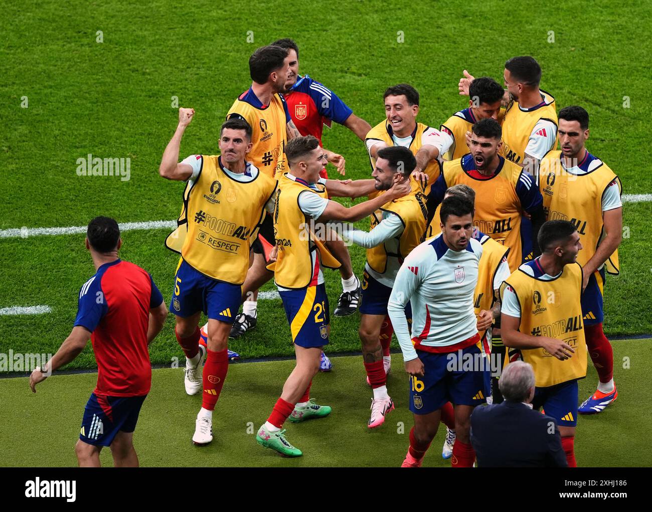 Spain players on the bench celebrate their side's first goal of the ...