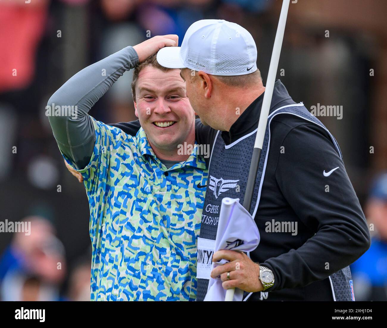 Robert MacIntyre hugs his caddie Michael Burrow, after he becomes ...