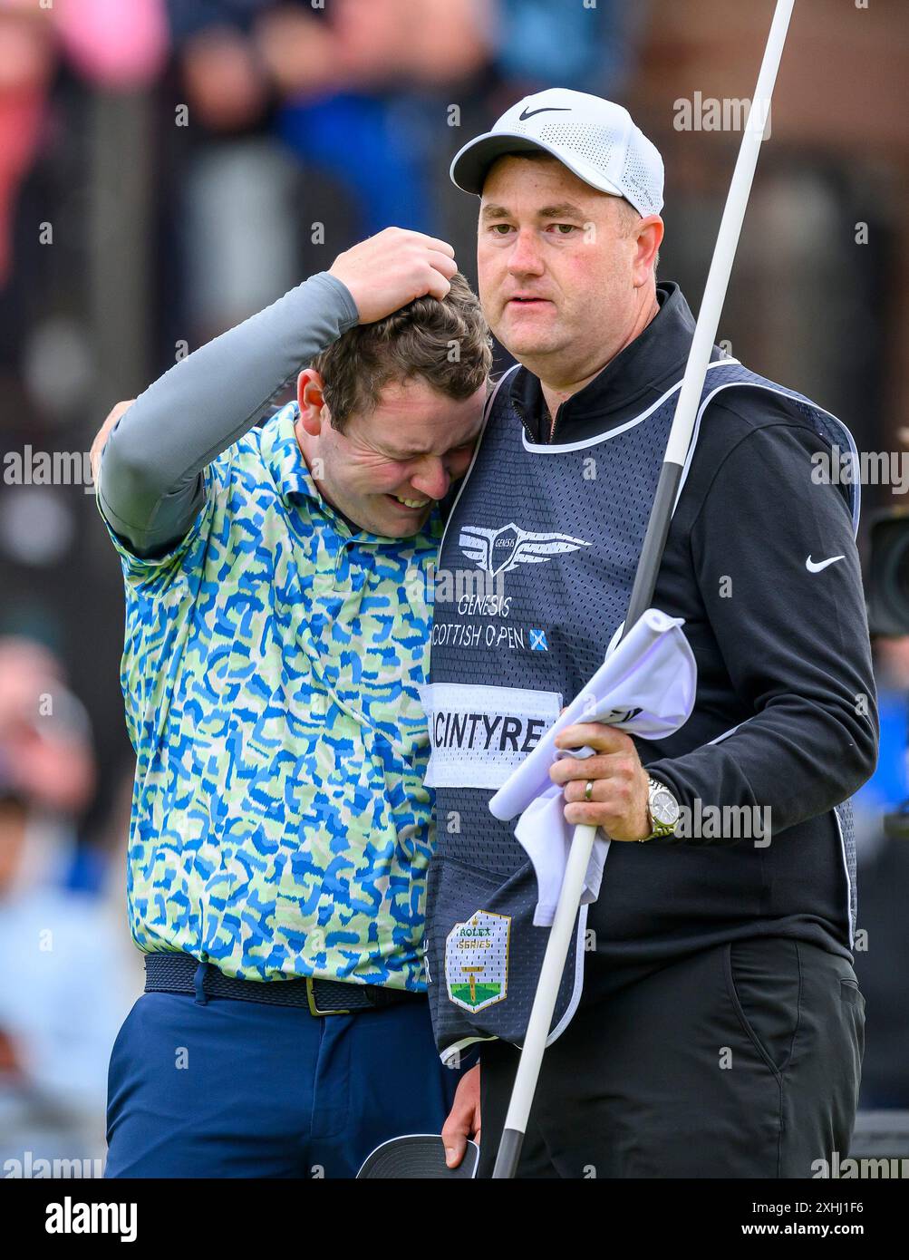 Robert MacIntyre hugs his caddie Michael Burrow, after he becomes ...