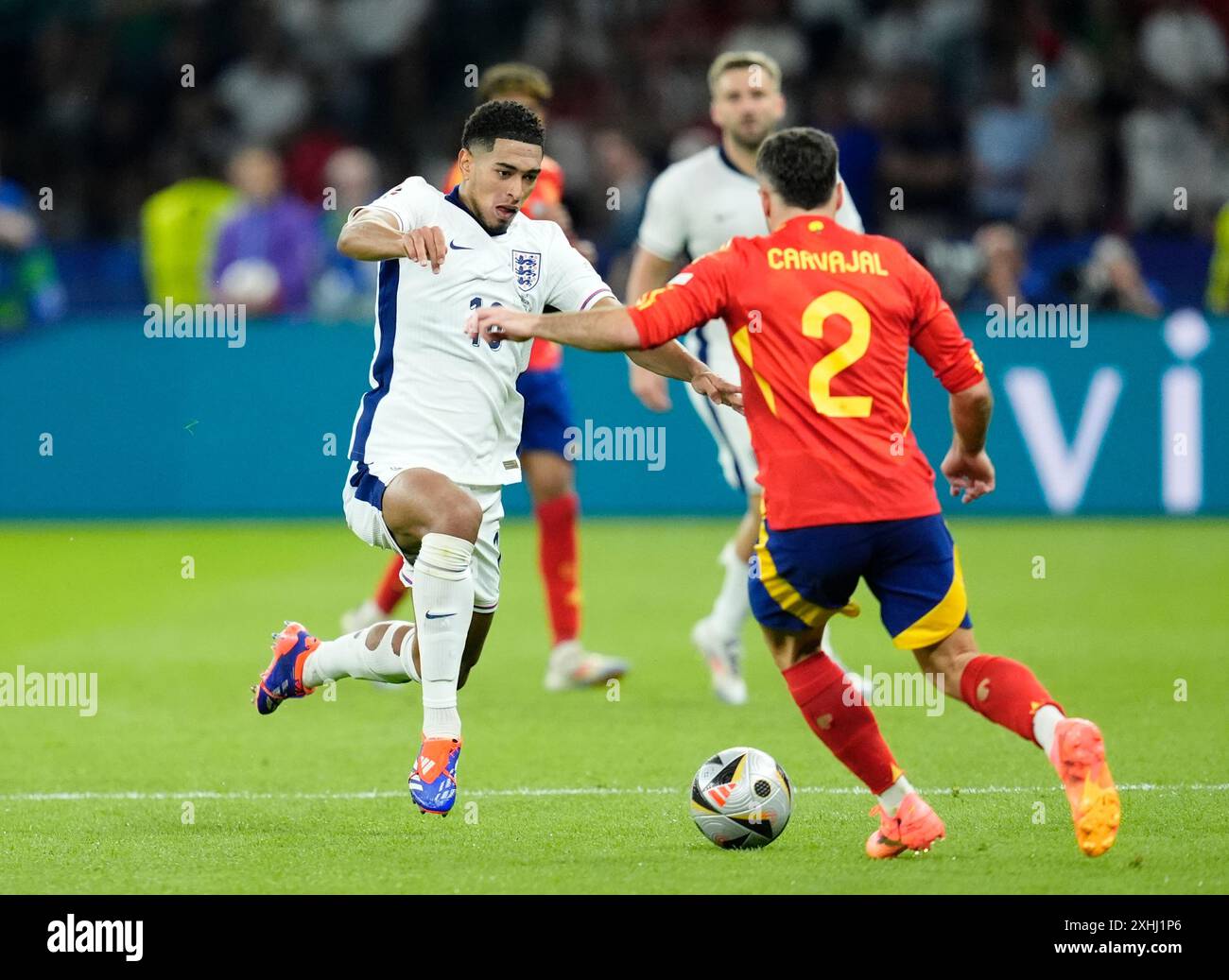 England's Jude Bellingham (left) and Spain's Daniel Carvajal in action ...