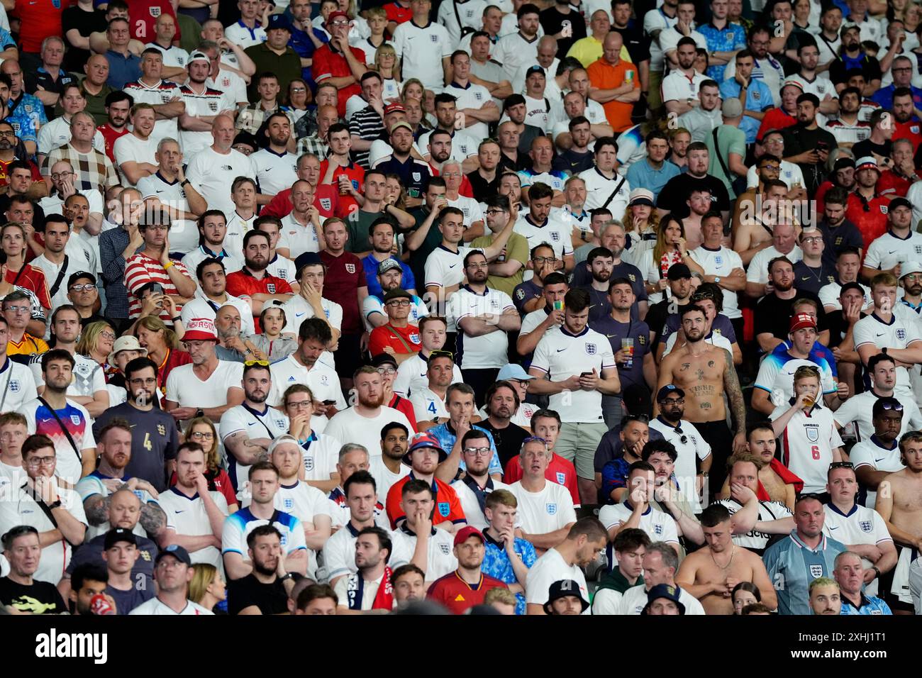 England fans appear dejected after Spain score the first goal during ...