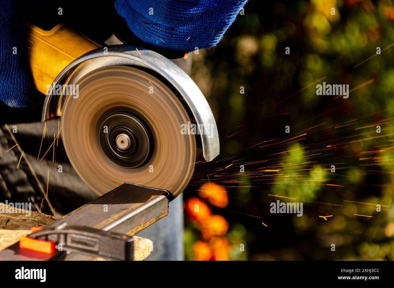 Disc power tool grinder in the hands of a man. Working with metal Stock ...