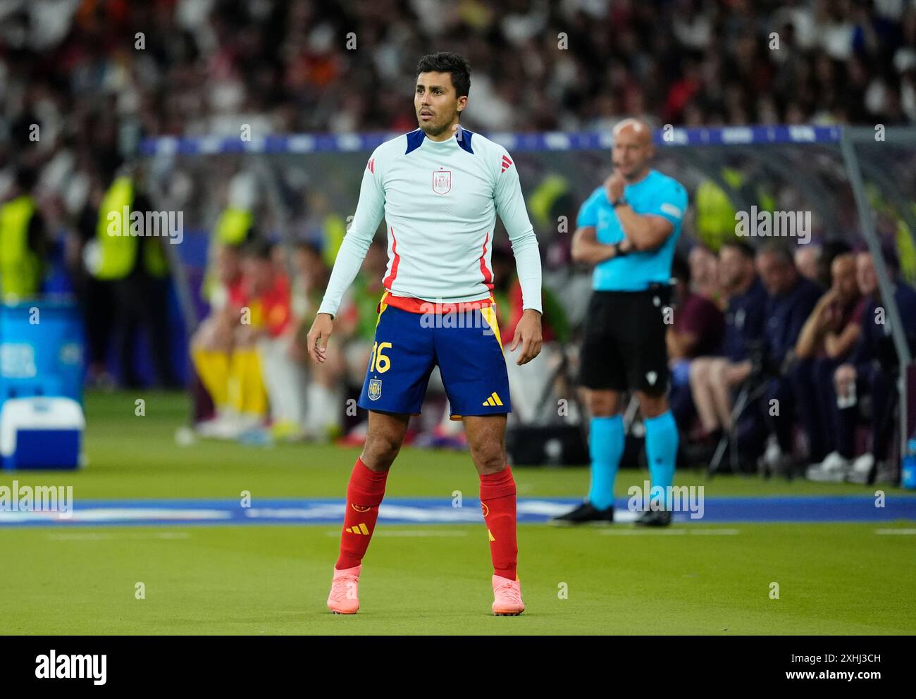 Spain's Rodri giving instructions to his team-mates from the touchline ...