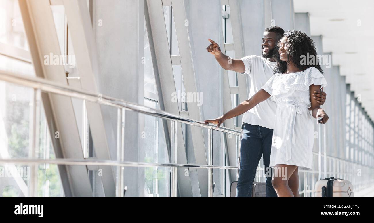 Couple Looking Out Airport Window Before Flight Departure Stock Photo ...