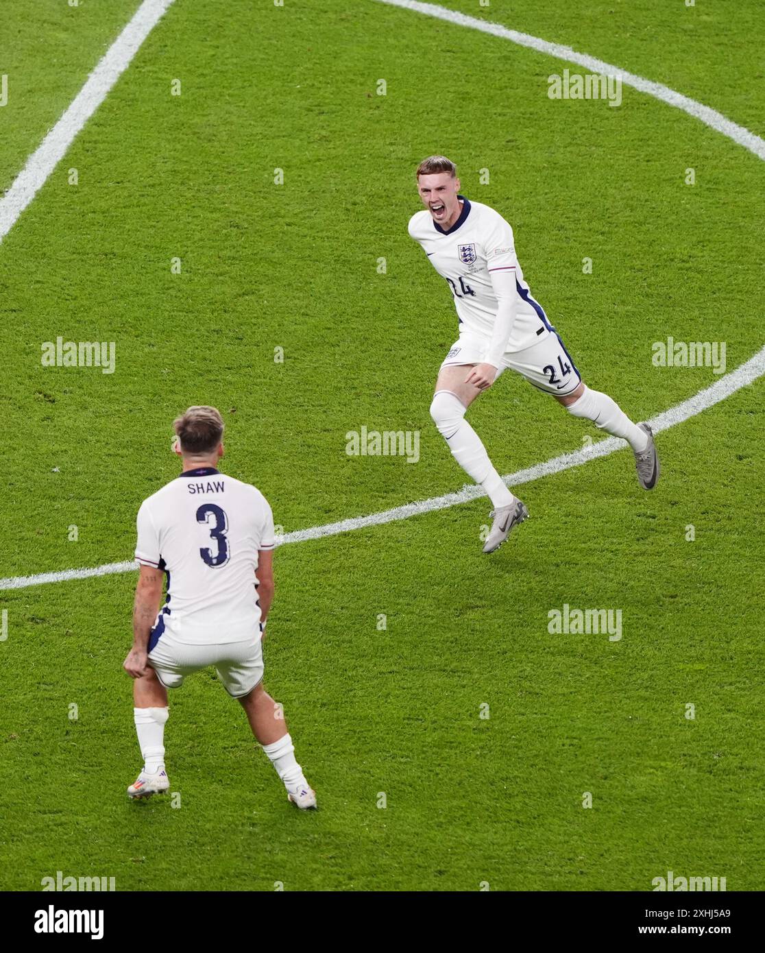 England's Cole Palmer (right) celebrates scoring their side's first ...