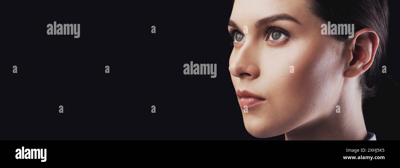 Portrait Of Female Face Staring Aside Over Black Background Stock Photo ...