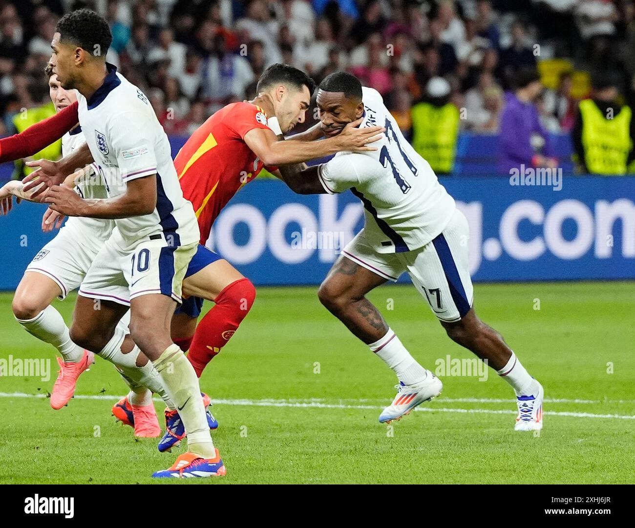 England's Ivan Toney (right) is blocked off by Spain's Mikel Merino ...