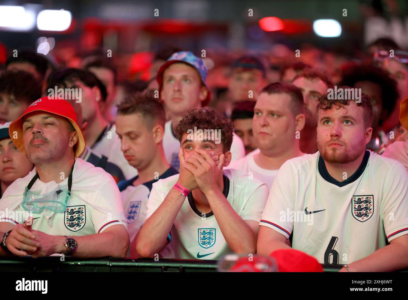 Disappointed England fans react at BOXPark Wembley in London during a ...