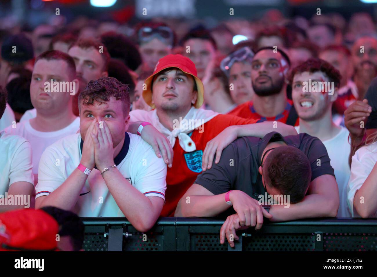 Disappointed England fans react at BOXPark Wembley in London during a ...
