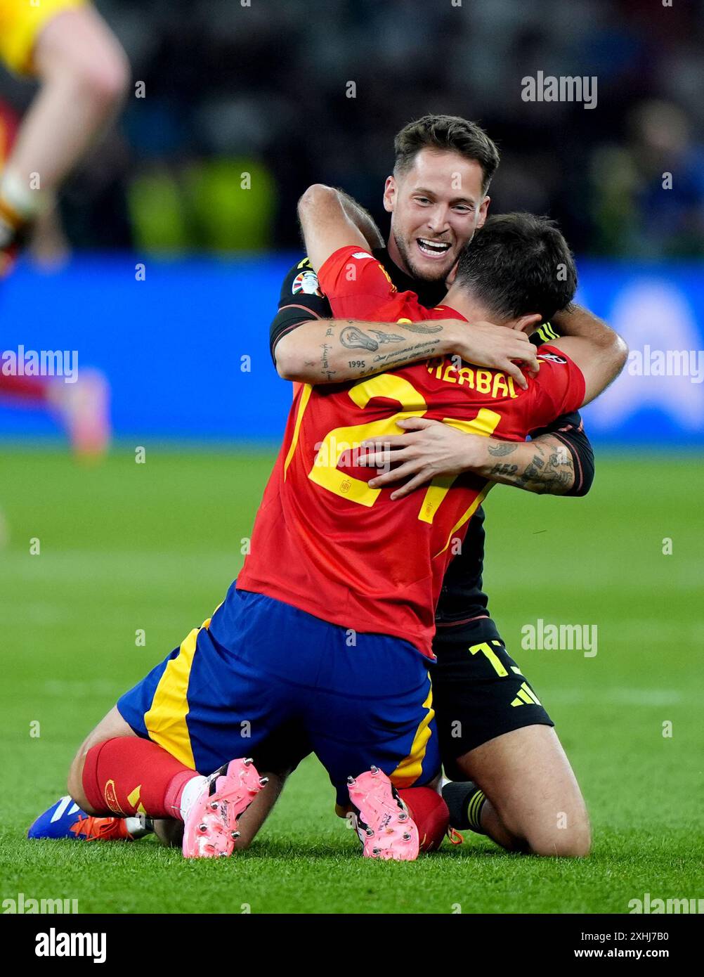 Spain’s winning goal scorer Mikel Oyarzabal is congratulated at the end ...