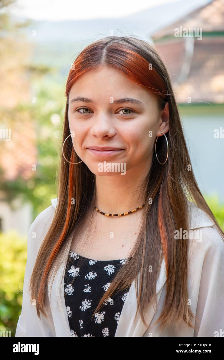 Young woman gently smiling hi-res stock photography and images - Alamy