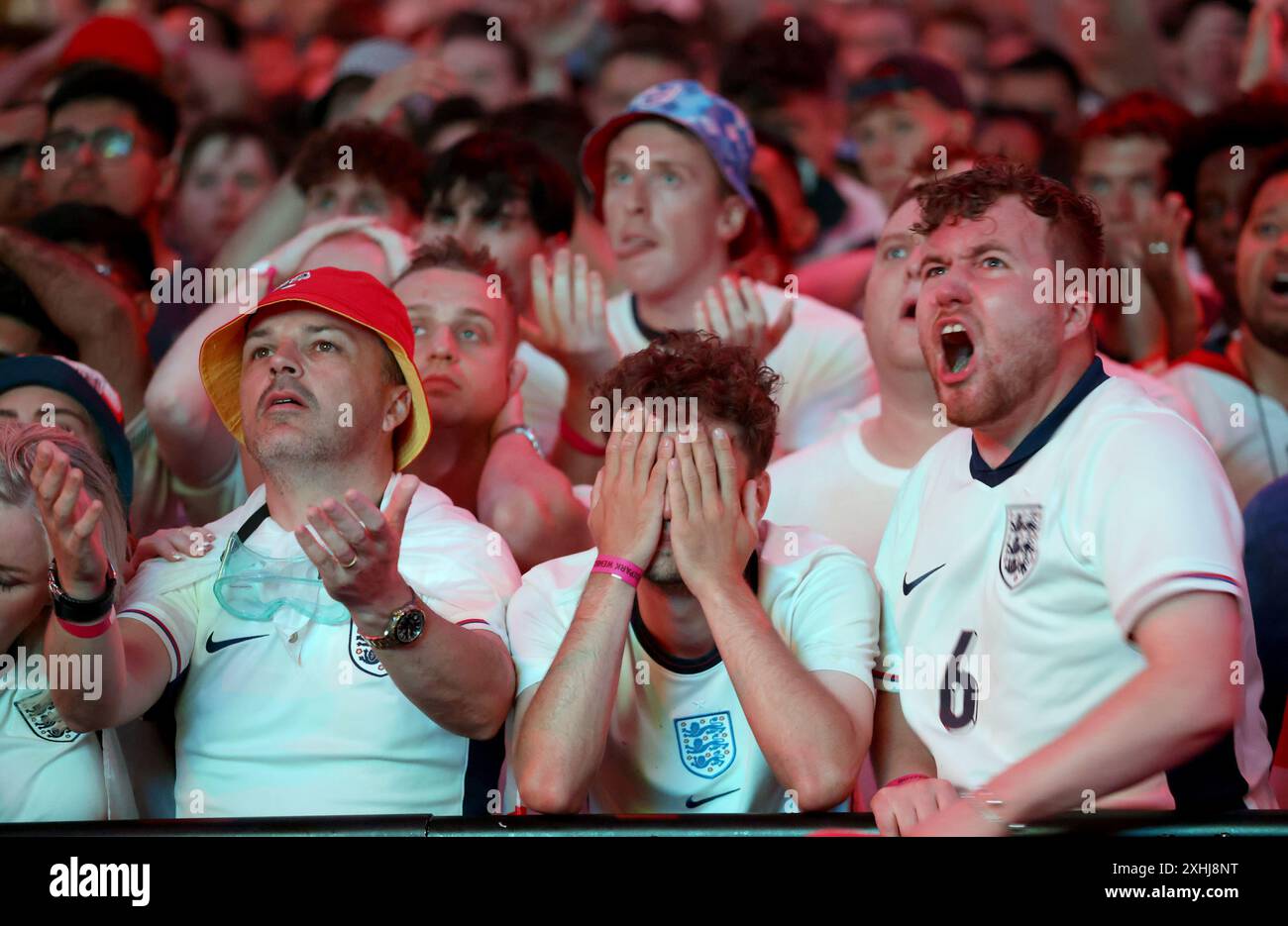 England fans react at BOXPark Wembley in London during a screening of ...