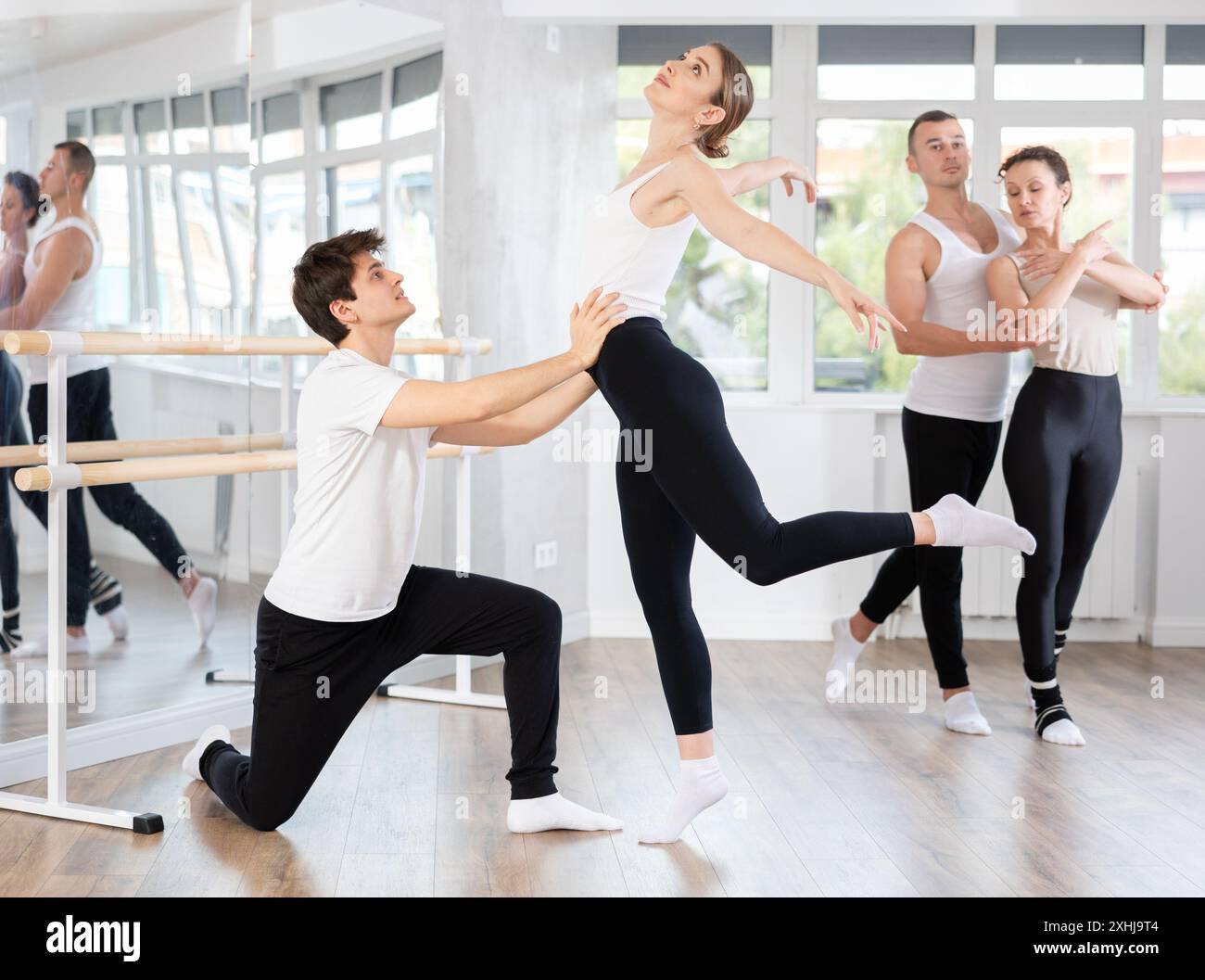Group young dancers interacting hi-res stock photography and images - Alamy
