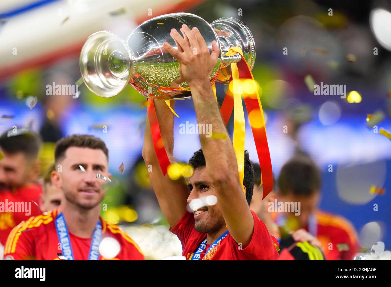Spain's Rodri holds the trophy after winning the final match between ...