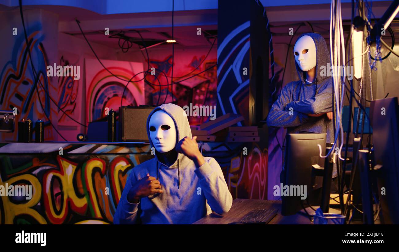 Hacker group members doing online terrorism acts, filming ransom video ...