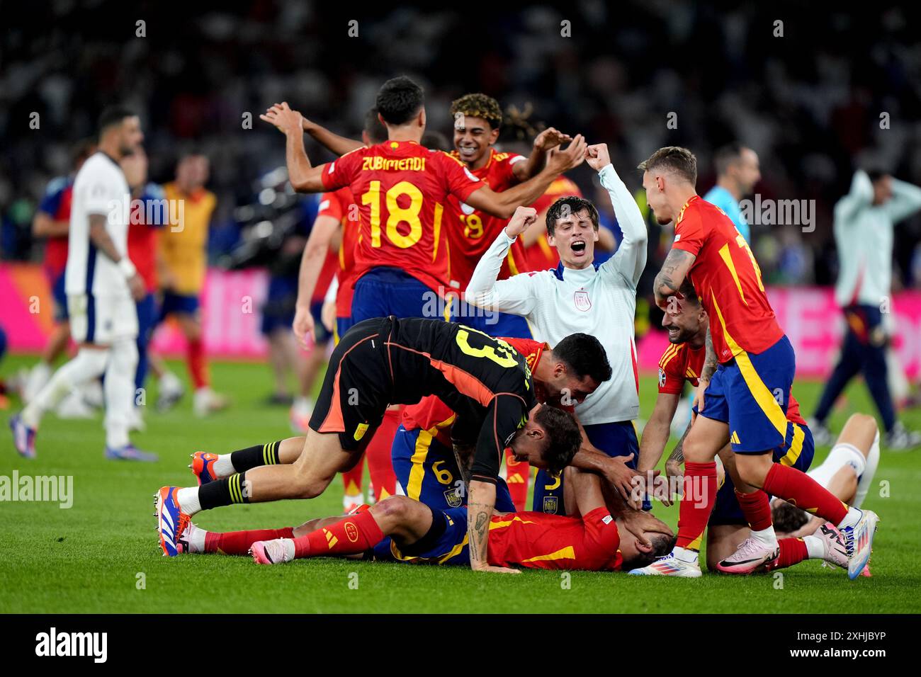 Spain’s players celebrate their victory at the final whistle after the ...