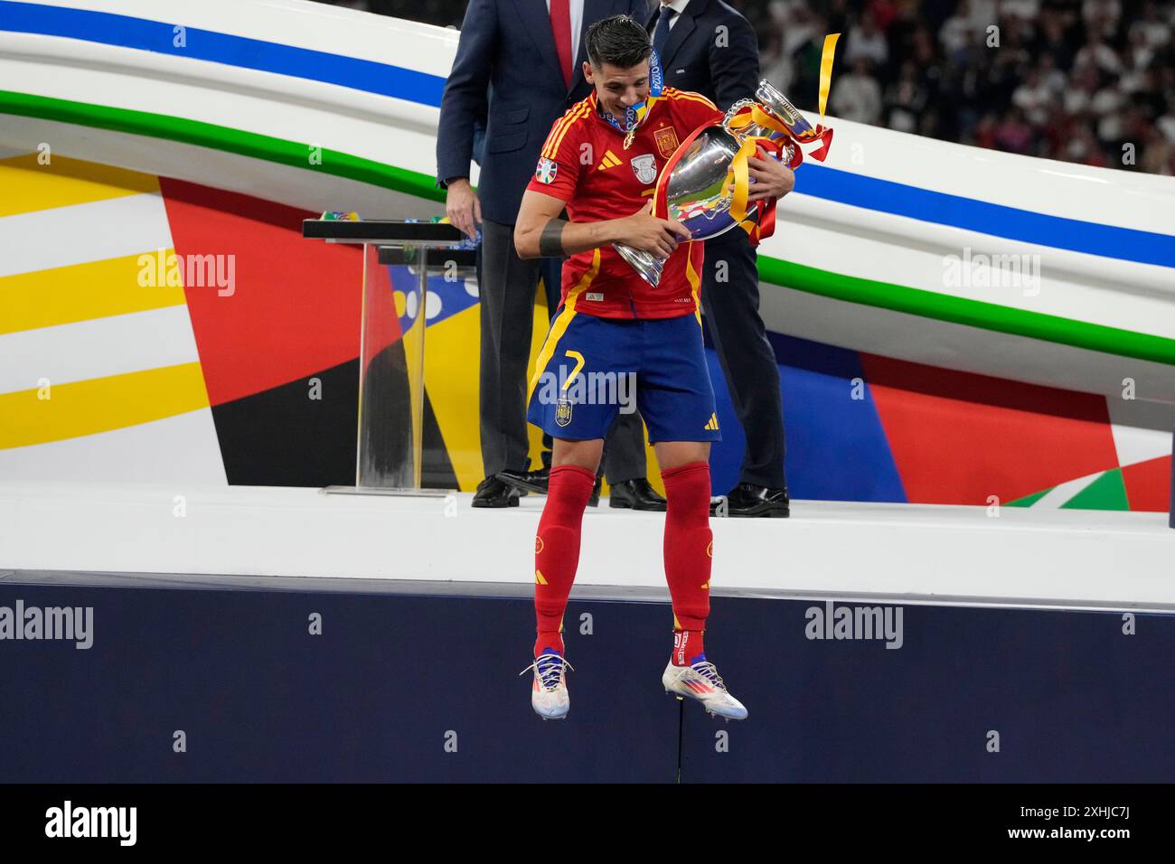 Spain's Alvaro Morata holds the trophy as he celebrates with his ...