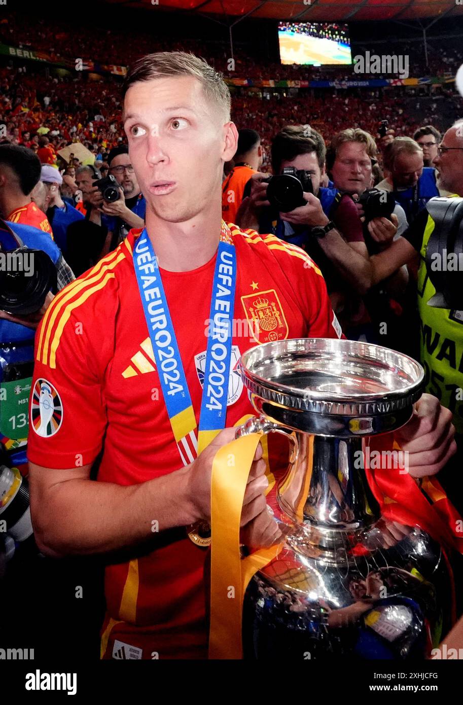 Spain’s Dani Olmo celebrates with the trophy after their victory after ...