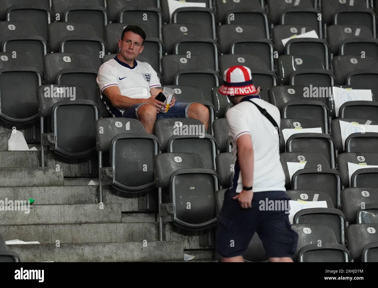 England fans still in the stands appear dejected after defeat against ...
