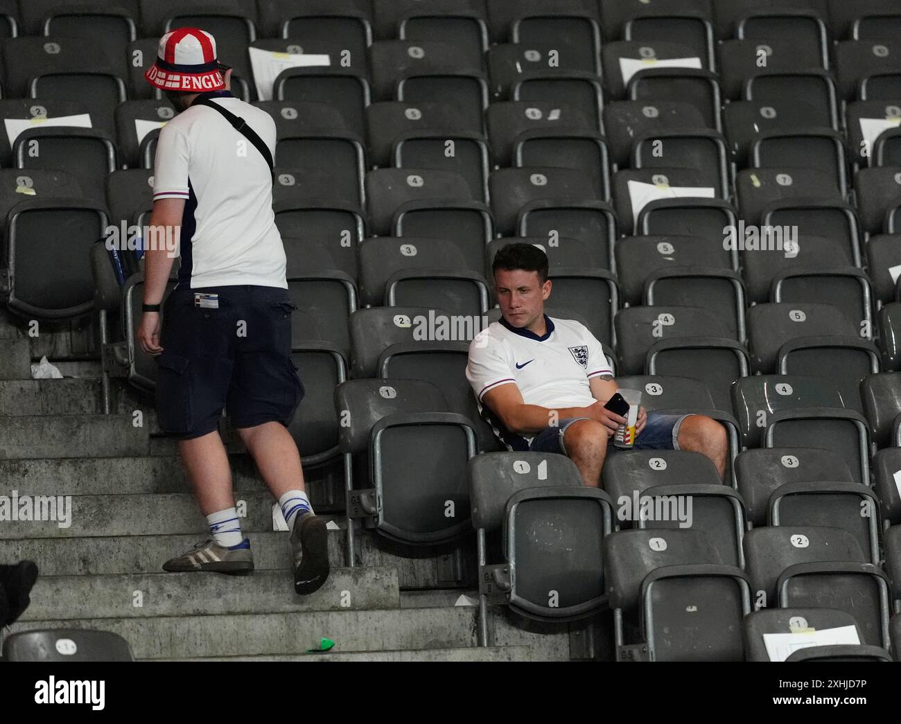 England fans still in the stands appear dejected after defeat against ...