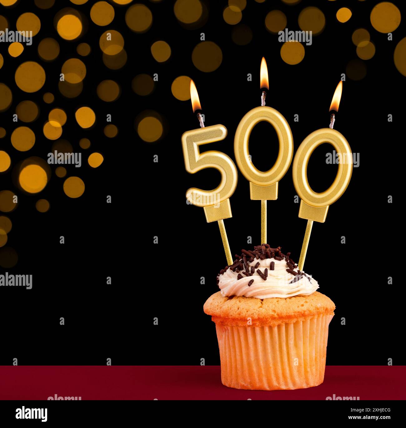 Number 500 birthday candle - Cupcake on black background with out of ...