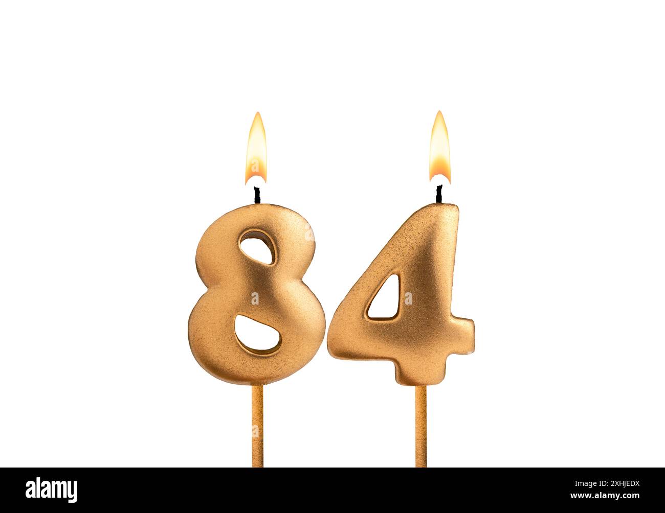 Birthday number 84 - Golden candle on white background Stock Photo - Alamy