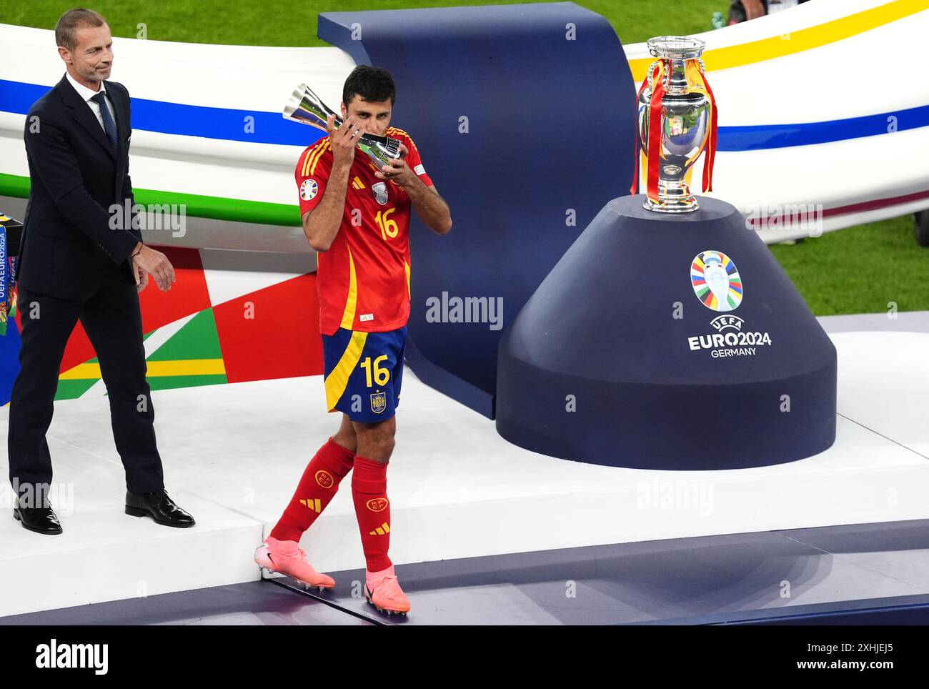 Spain's Rodri with the trophy for best player of the tournament ...