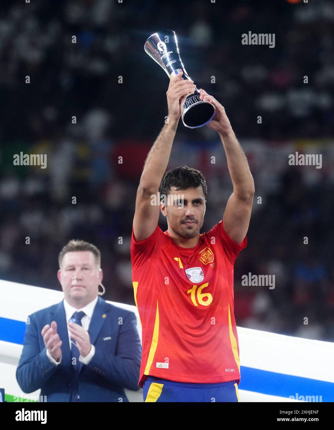 Spain's Rodri is awarded the Player of the Tournament trophy after ...