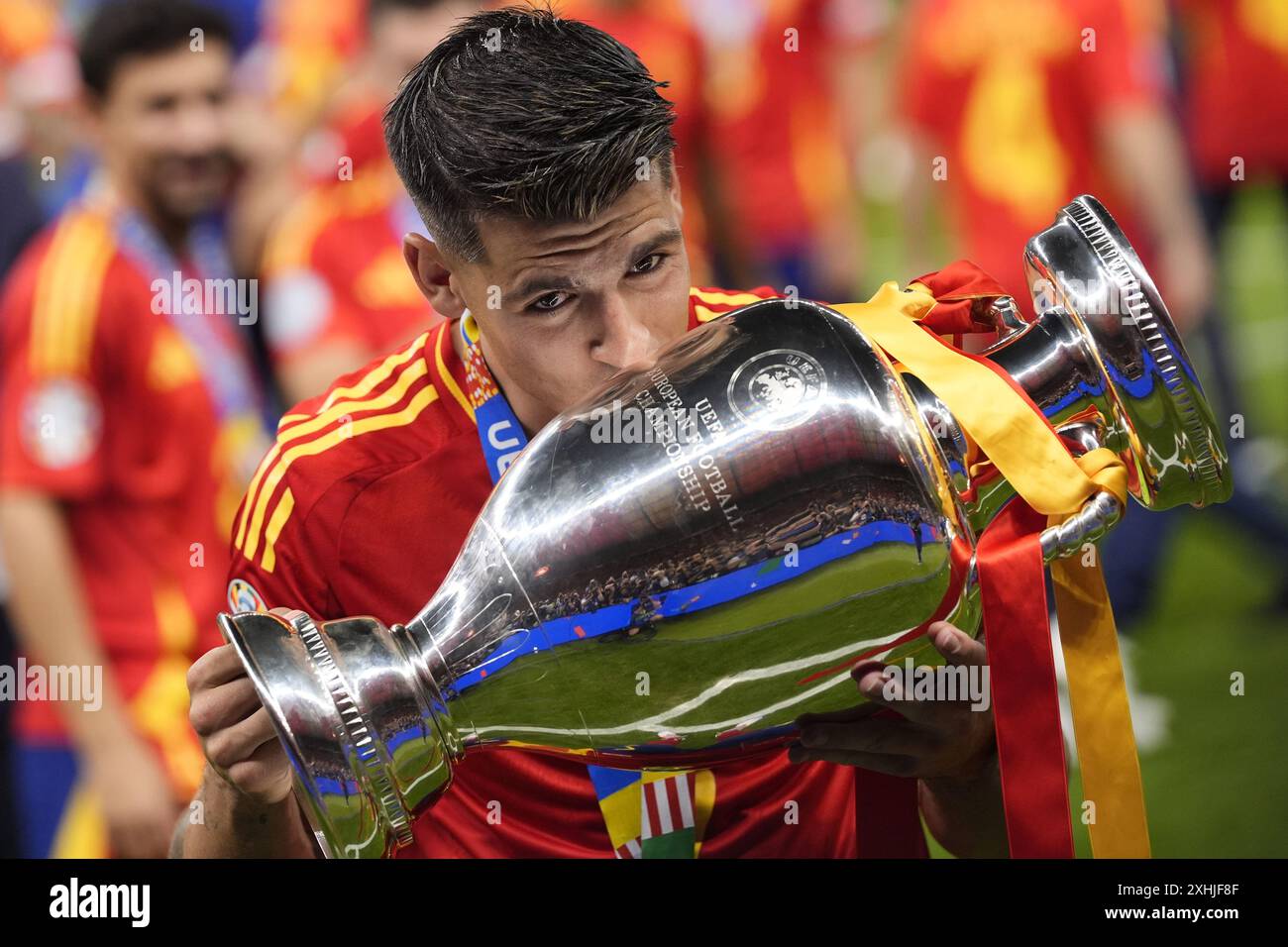 Spain's Alvaro Morata with the trophy celebrates after a final match ...