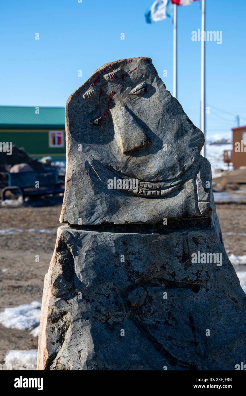 Inuit stone carving of a face at Iqaluit Square in Iqaluit, Nunavut ...