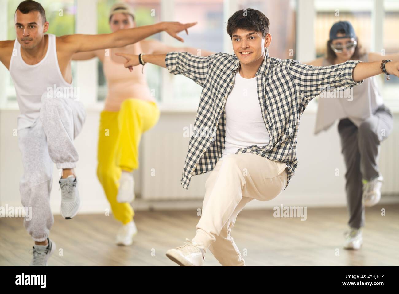 Young guy practicing hip hop reject step in training hall Stock Photo ...