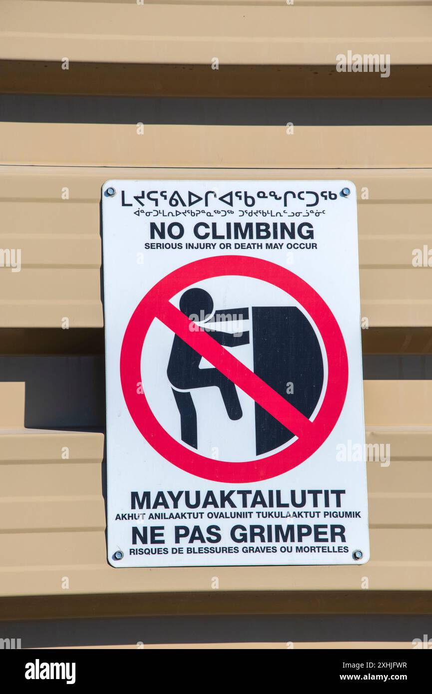 Multilingual no climbing sign in English, French, Inuktitut and ...