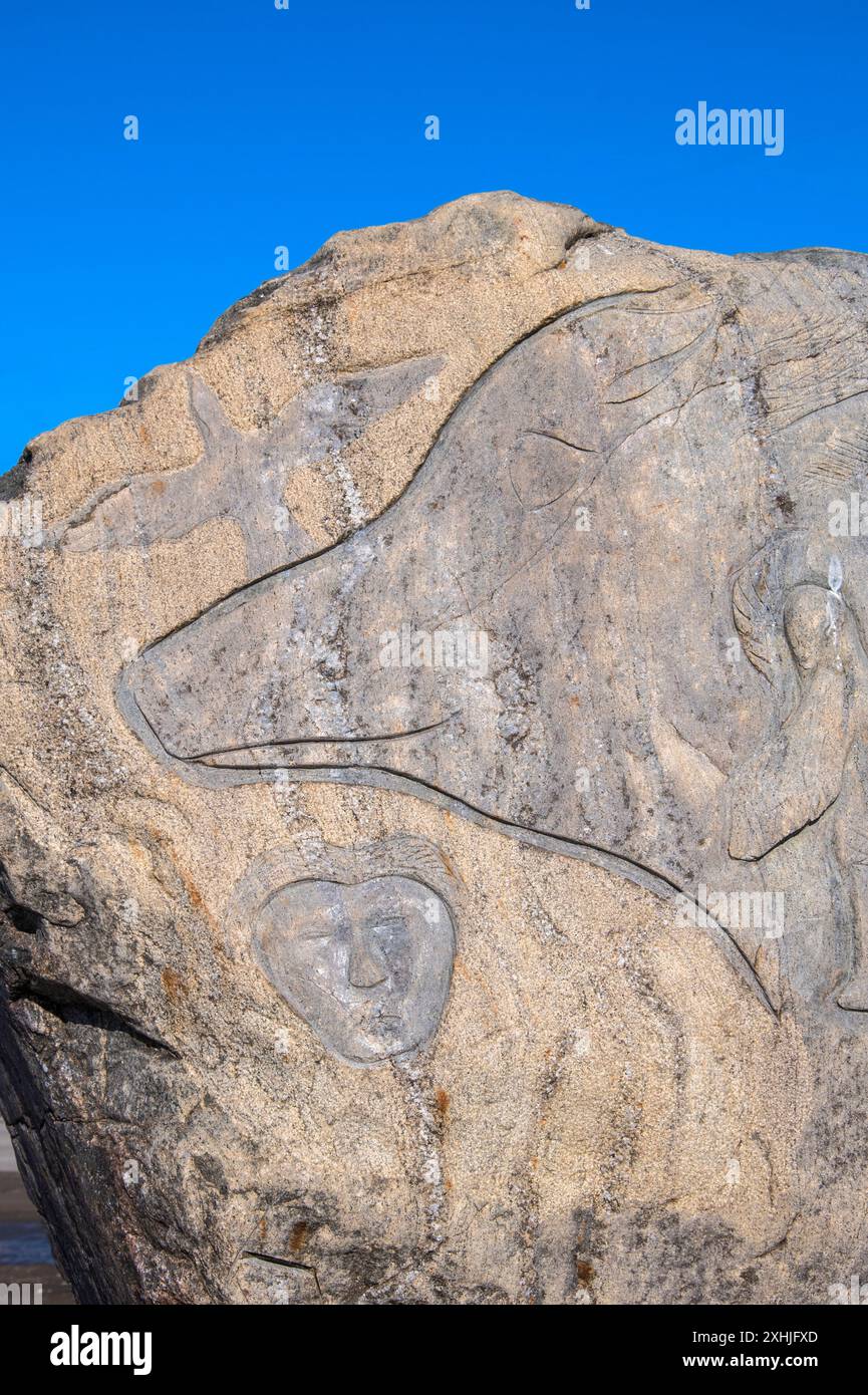 Stone carving of sled dog face at Inuit sculpture park by the Four ...